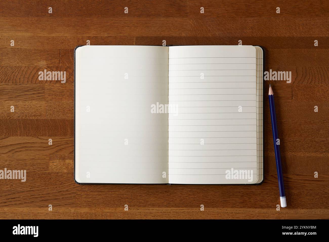 Wooden desk, open white notebook with plain and horizontal lines Stock ...