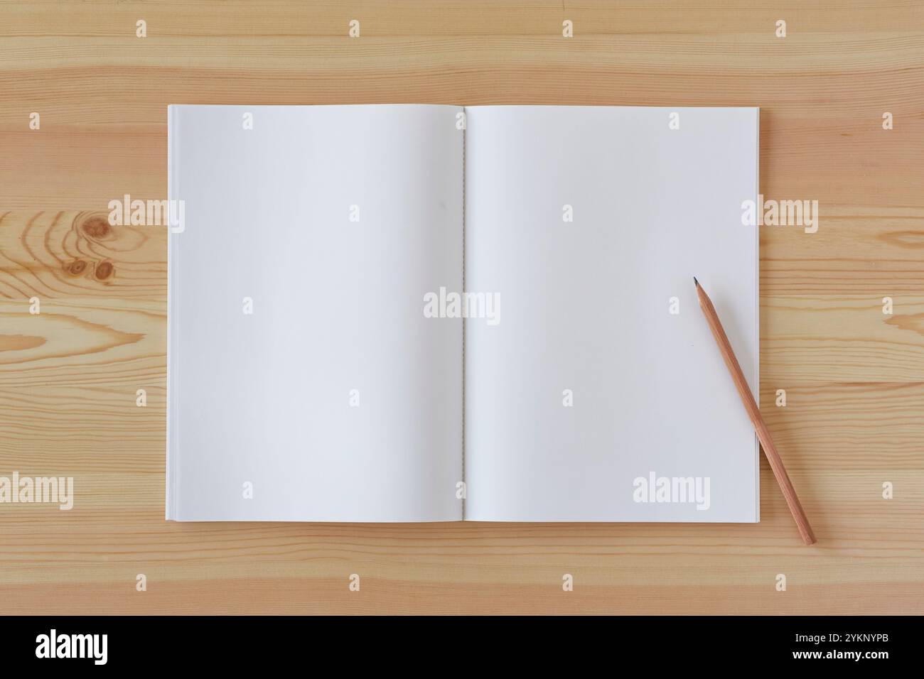 Wooden desk, notebook and pencil Stock Photo - Alamy
