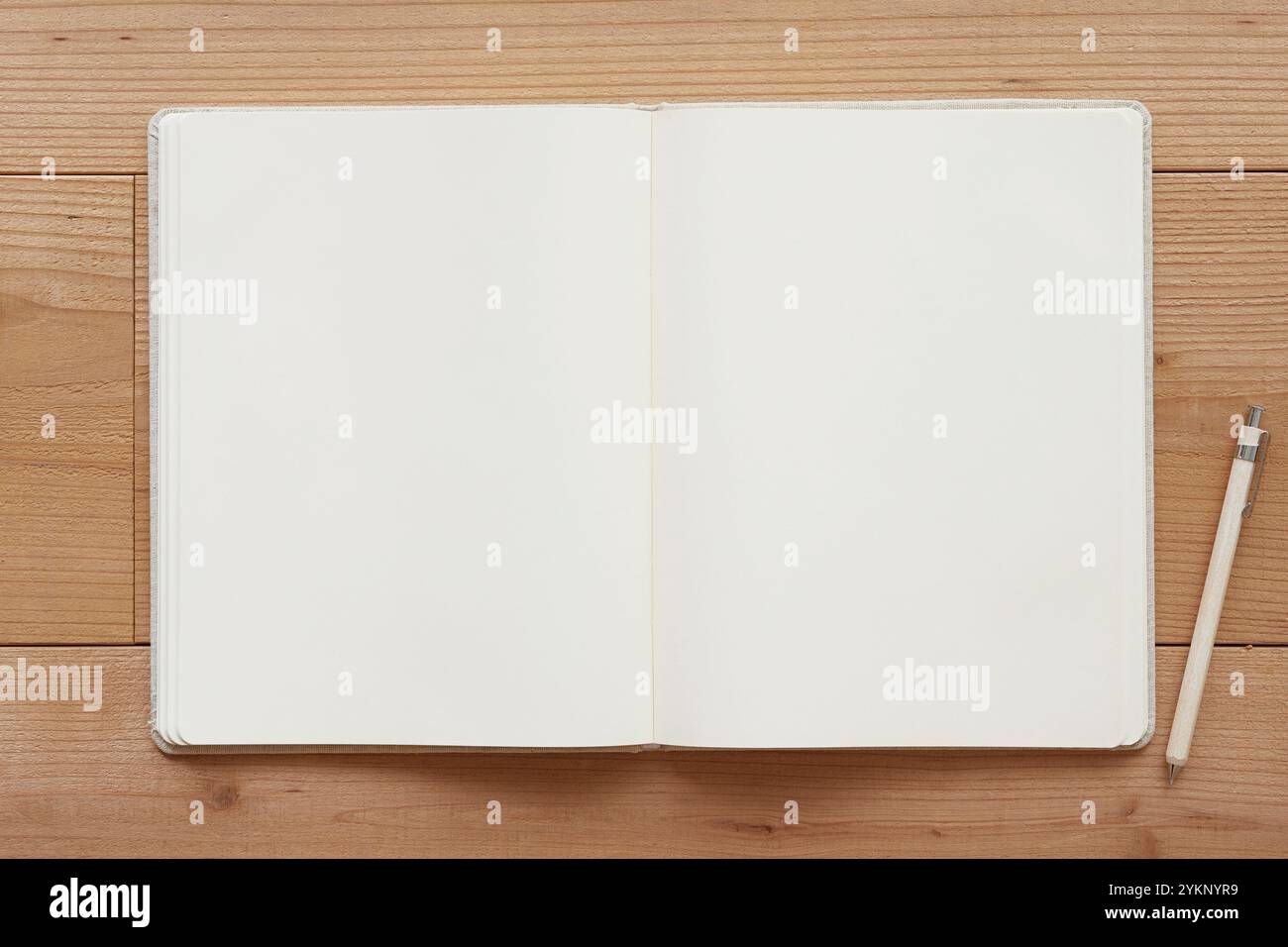 Wooden desk and notebook Stock Photo - Alamy