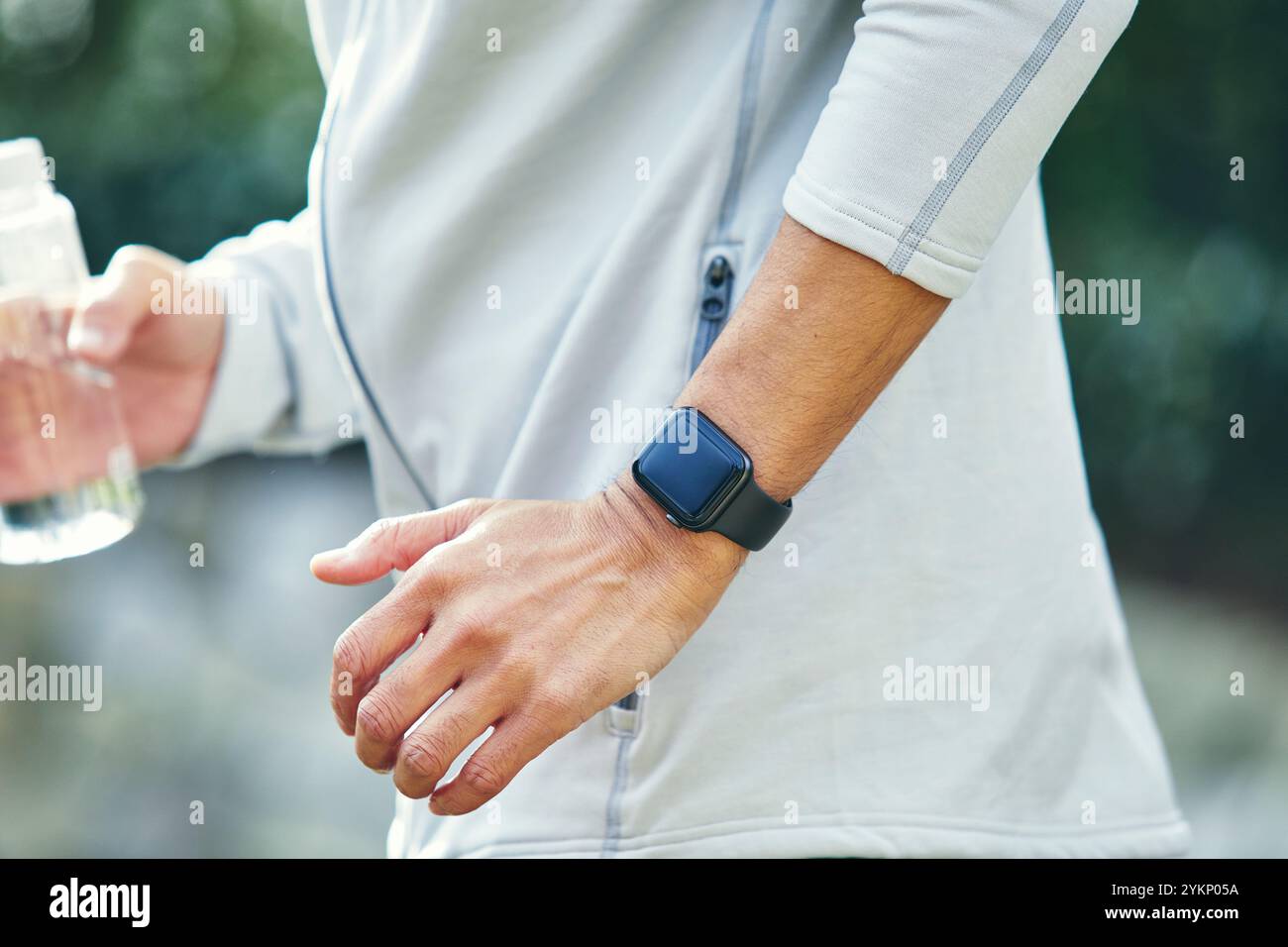Man wearing a smartwatch Stock Photo - Alamy