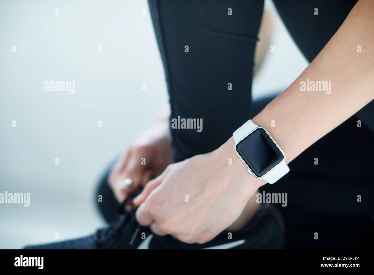 Hand of a woman wearing a smartwatch Stock Photo - Alamy