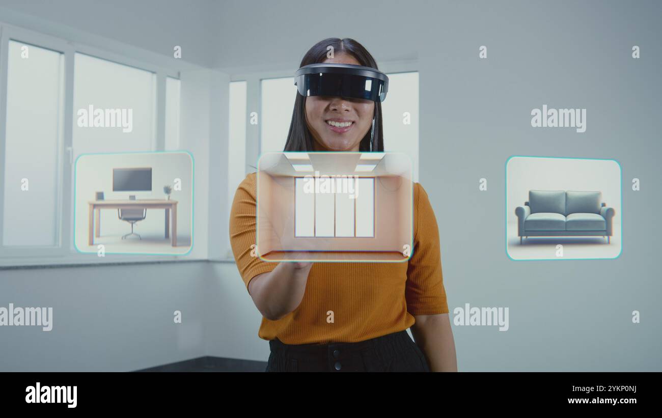 Creative Asian female designer wearing VR headset uses online design ...