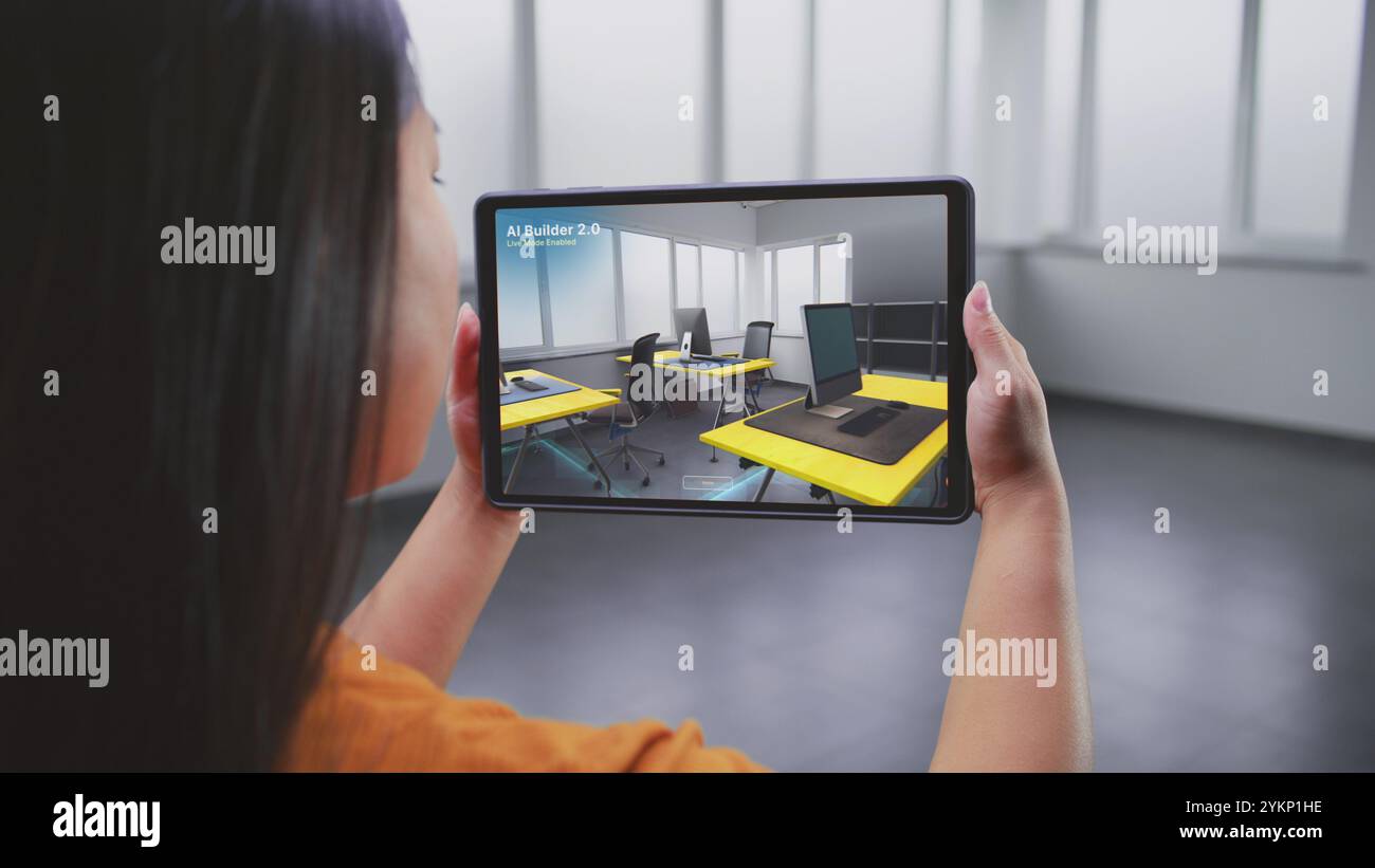 Asian female designer uses tablet computer and virtual reality interior ...