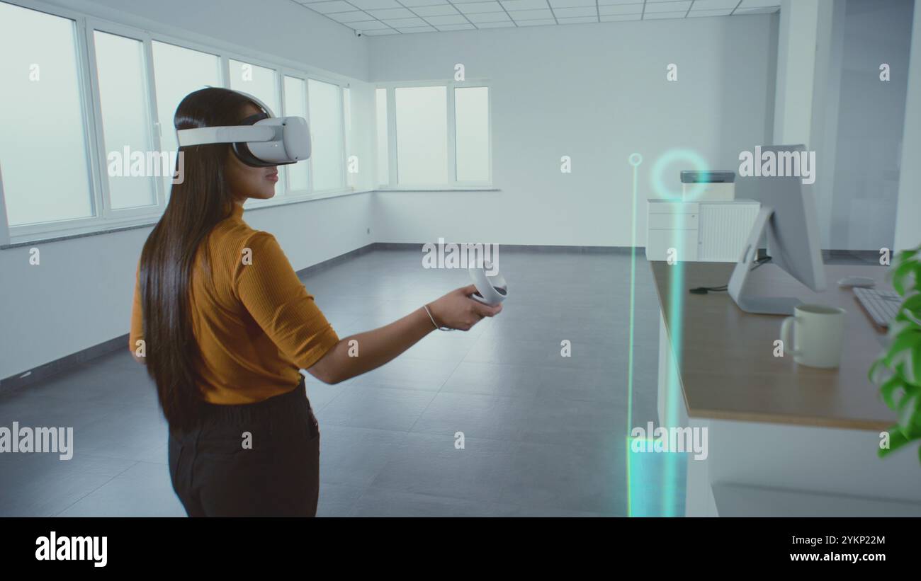 Creative Asian female designer wearing augmented reality headset uses ...