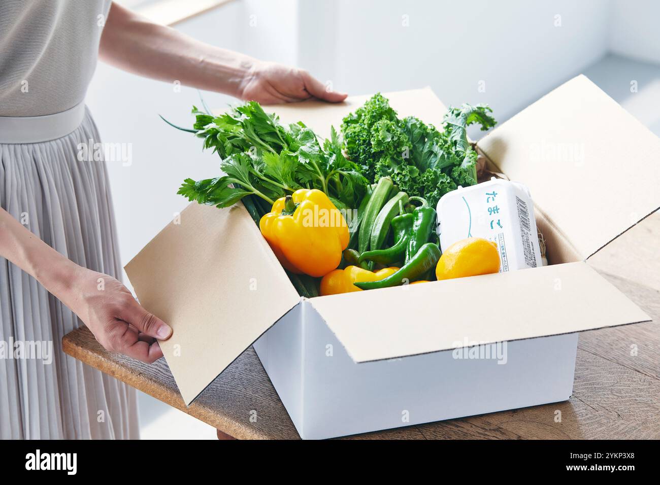 Woman delivery courier taking boxes hi-res stock photography and images ...