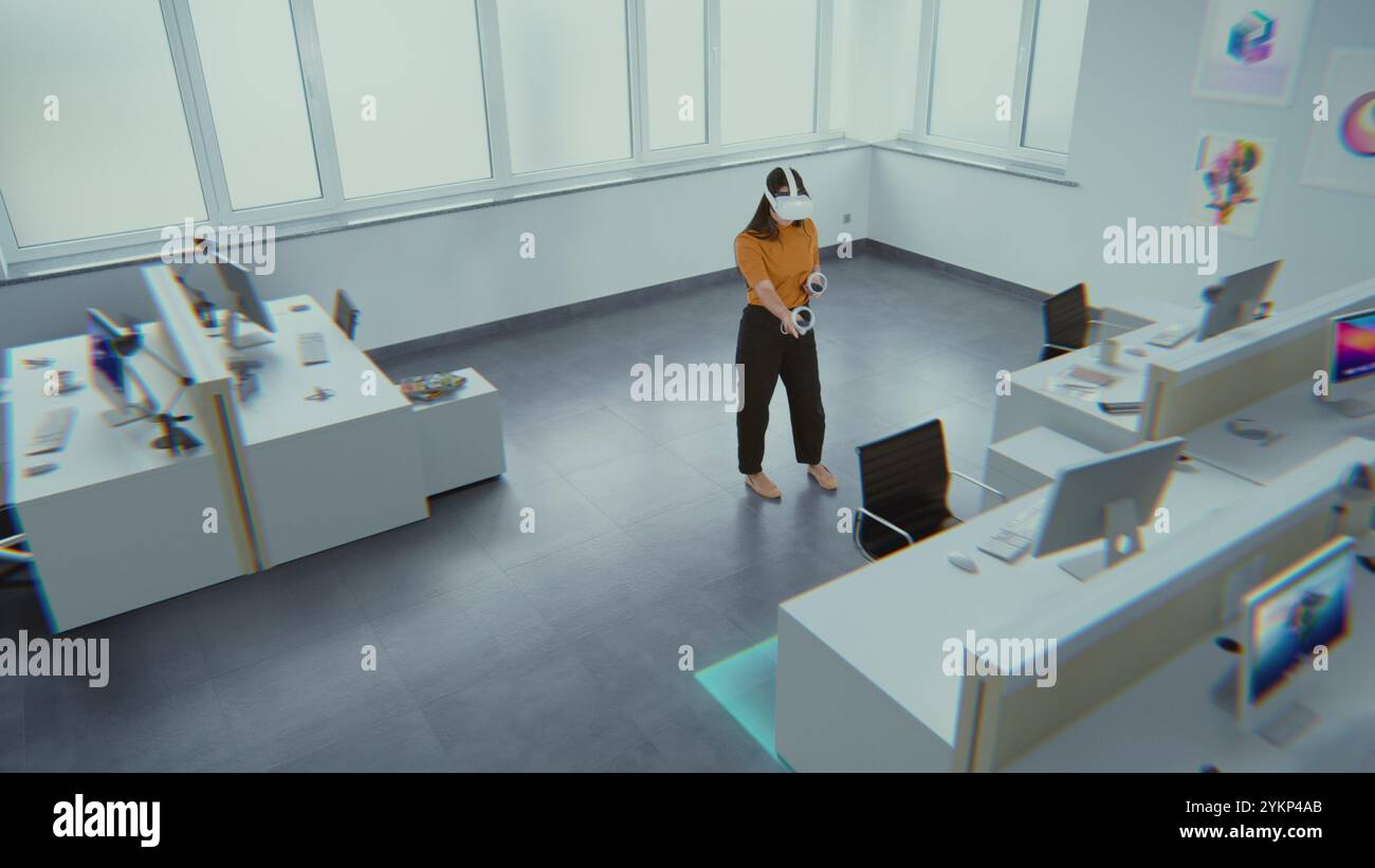 Creative Asian female designer wearing augmented reality headset uses ...