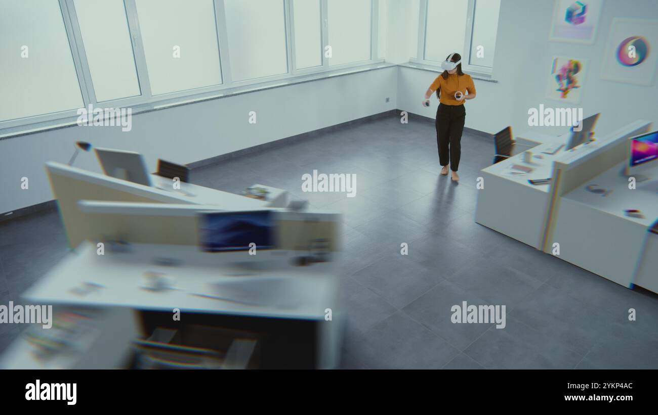 Creative Asian female designer wearing augmented reality headset uses ...