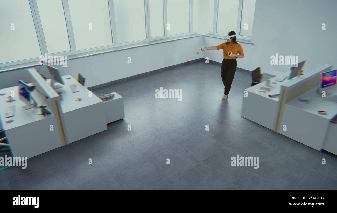 Asian female designer in virtual reality headset uses augmented reality interior design app and ...