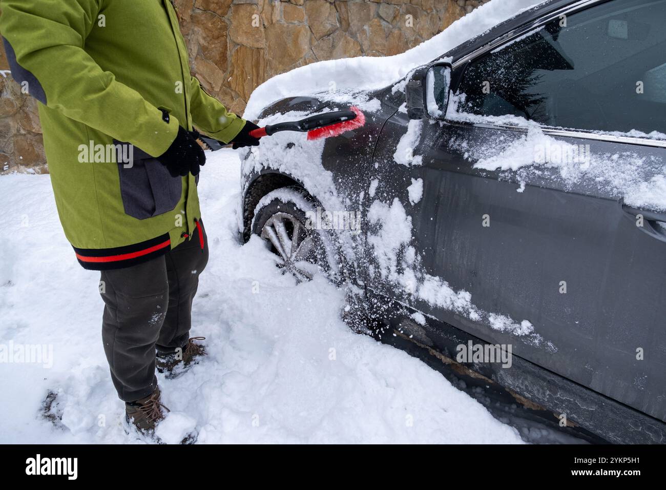 Person Clearing Snow from Car in Winter Landscape Stock Photo - Alamy