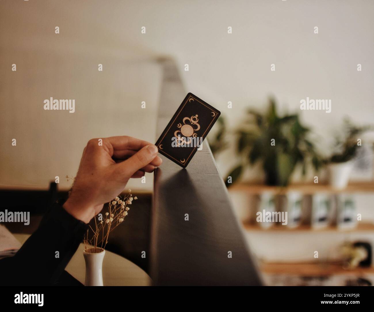 Artistic tarot cards from the Deviant Moon deck held in hands ...