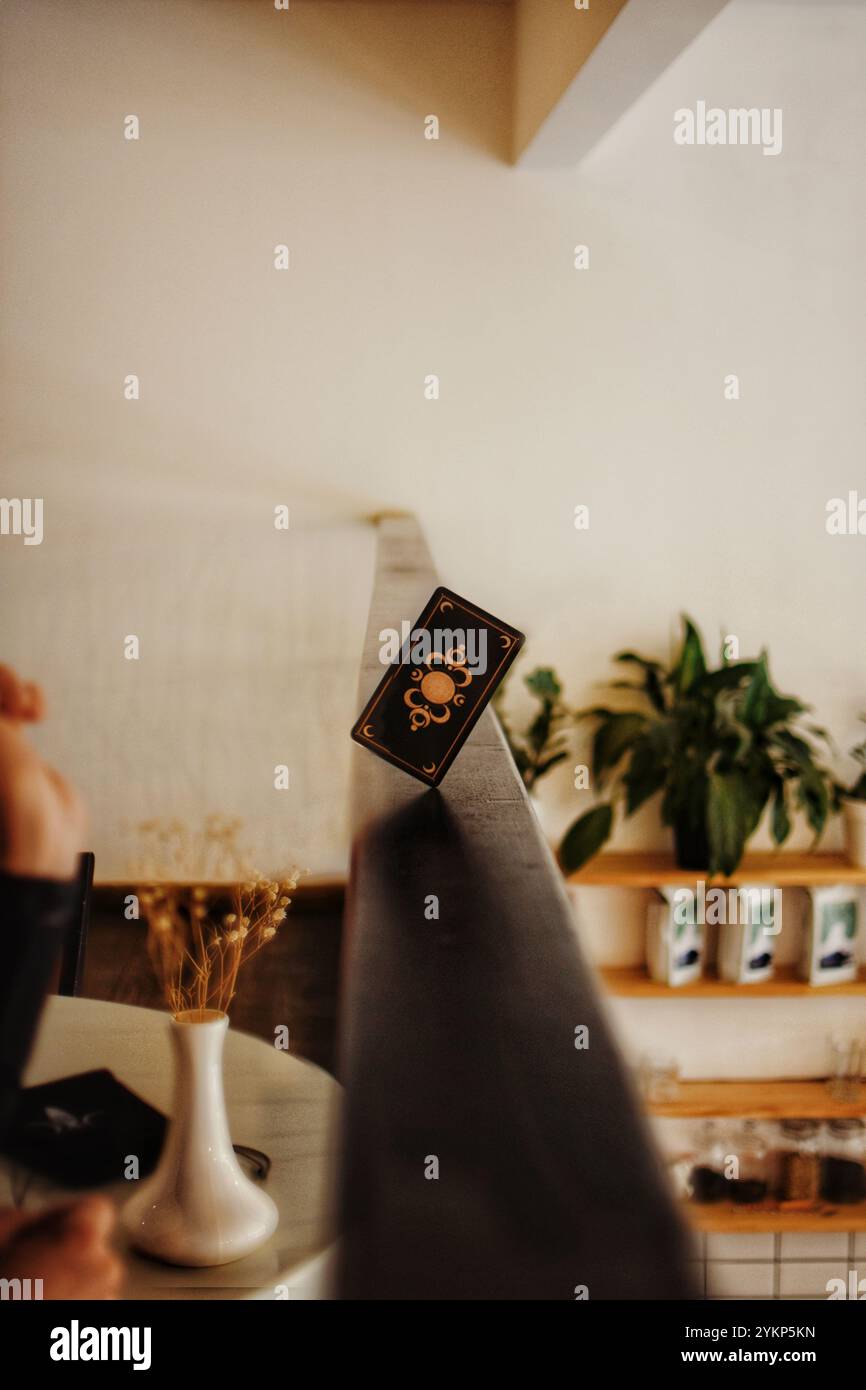 Artistic tarot cards from the Deviant Moon deck held in hands ...