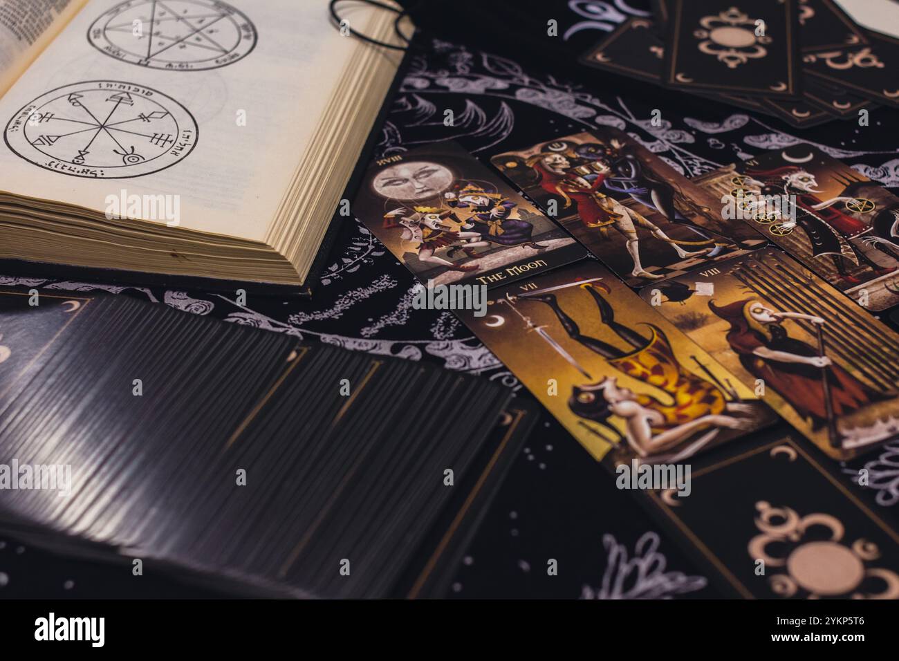 Artistic tarot cards from the Deviant Moon deck held in hands ...