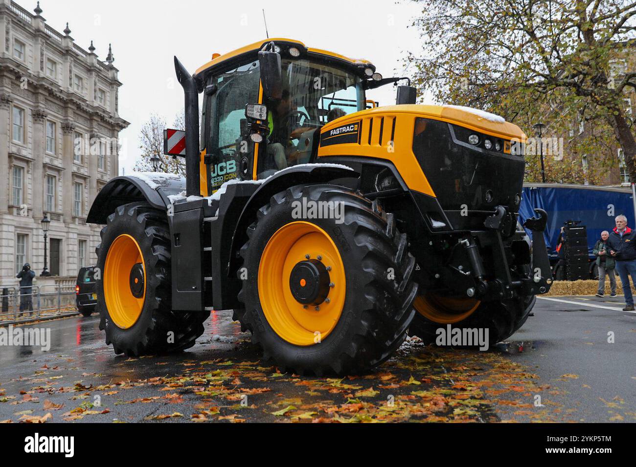 London, UK, 19th November 2024.One large yellow tractor arrives on ...