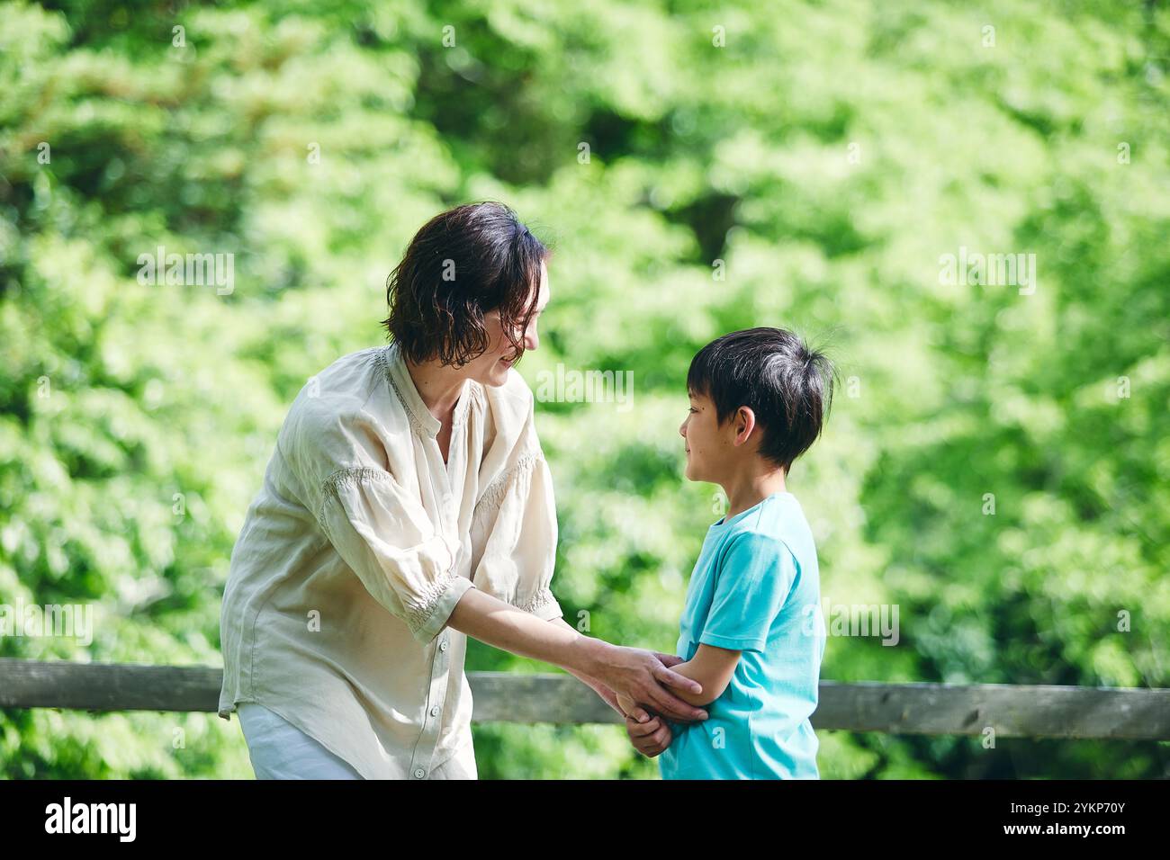 Parent and child holding hands outdoors Stock Photo - Alamy