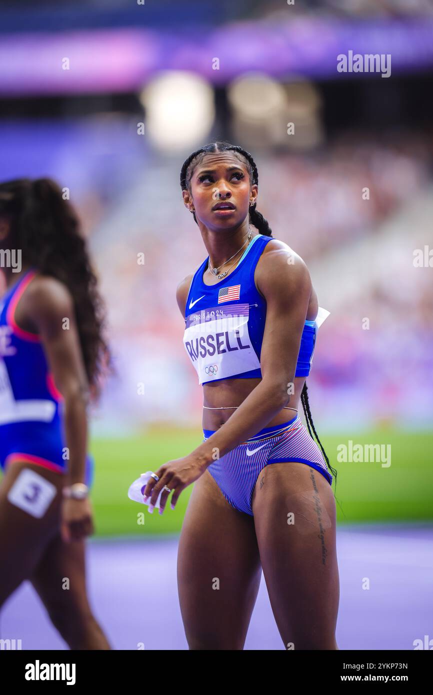 Masai Russell participating in the 100 meters hurdles at the Paris 2024 ...