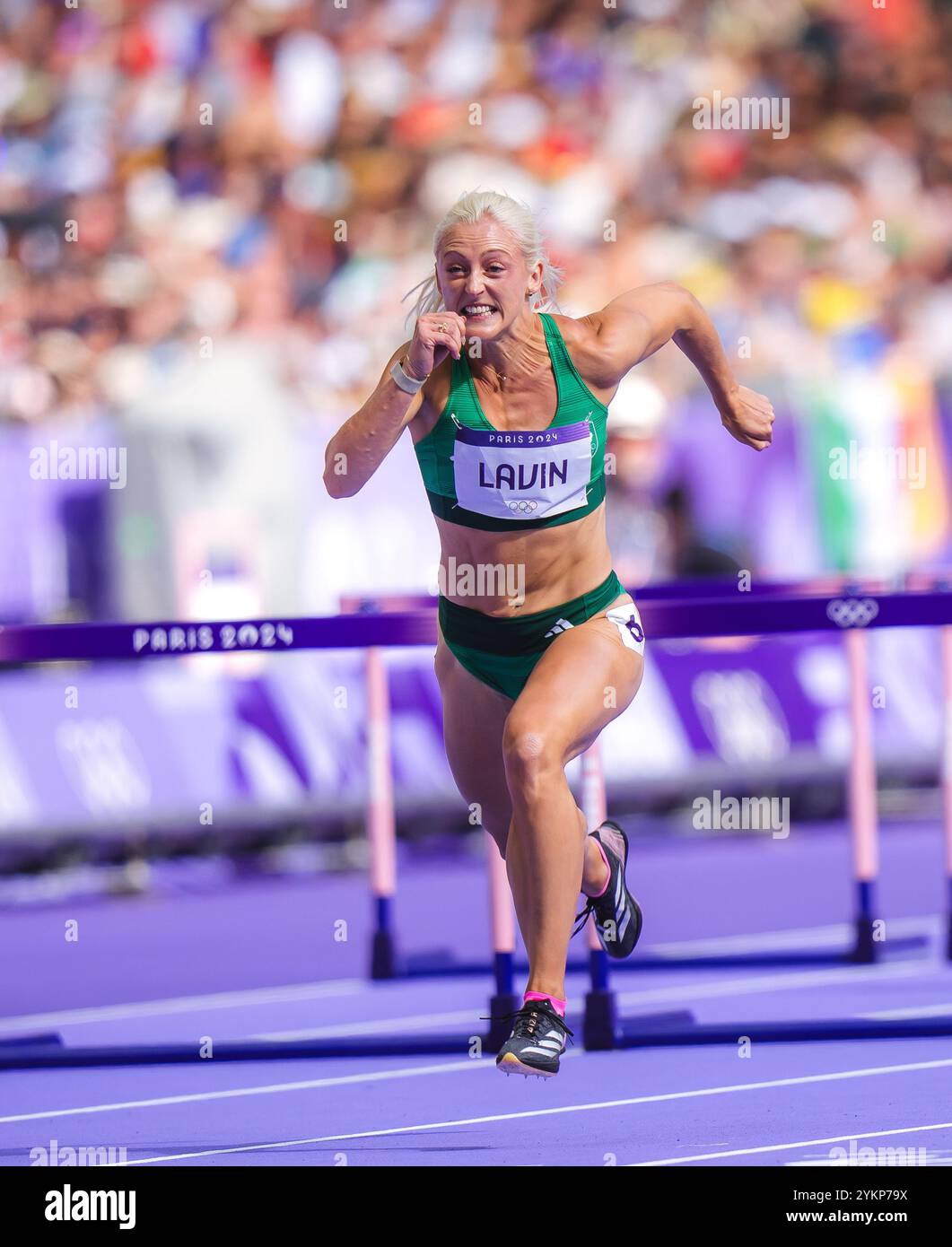 Sarah Lavin participating in the 100 meters hurdles at the Paris 2024 ...