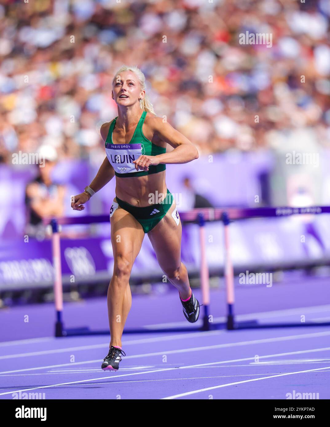 Sarah Lavin participating in the 100 meters hurdles at the Paris 2024 ...