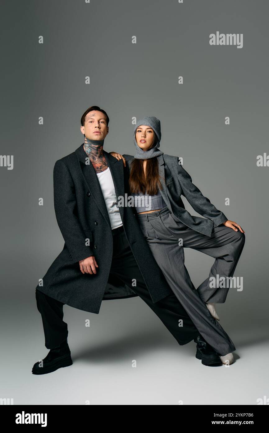A young couple showcases modern fashion with confidence and creativity ...