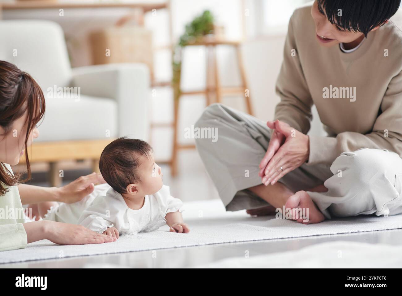 Parent and child playing in the living room Stock Photo - Alamy