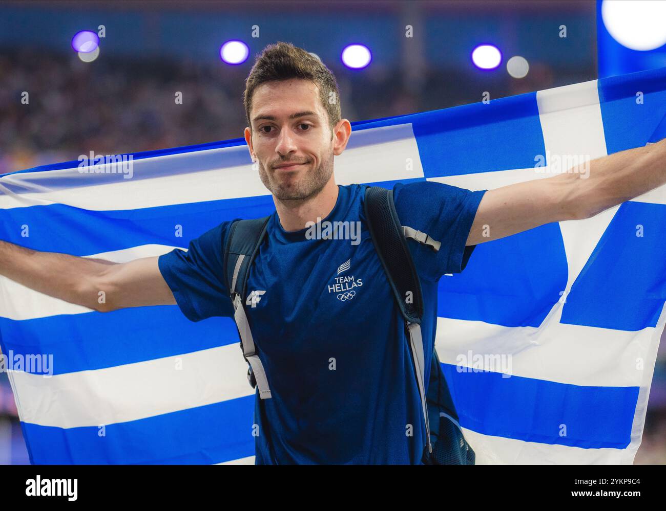 Miltiadis Tentoglu celebrating her medal with her country's flag at the ...