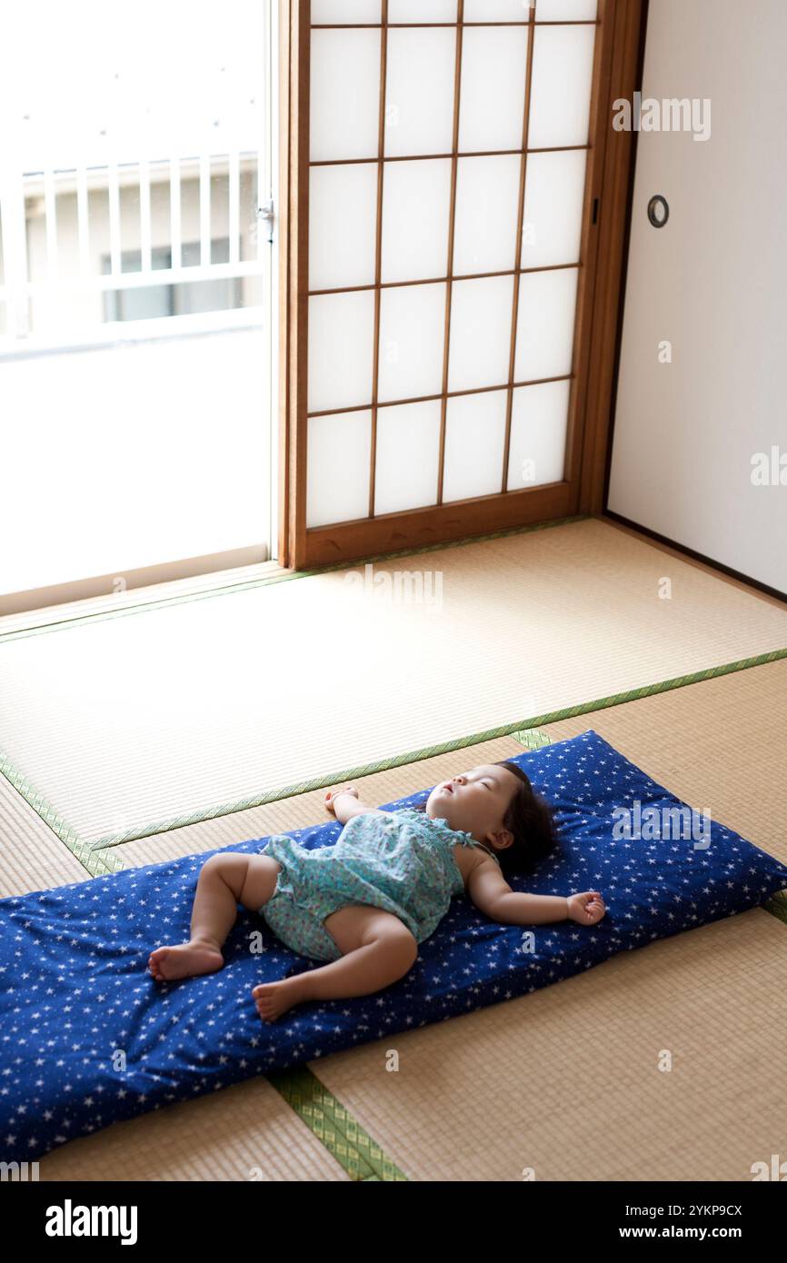 Baby napping in a sunny room Stock Photo - Alamy