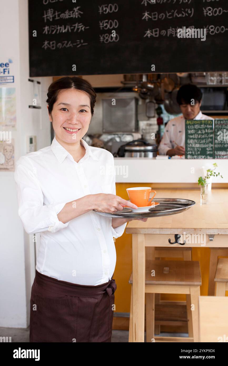 Woman serving coffee office hi-res stock photography and images - Alamy