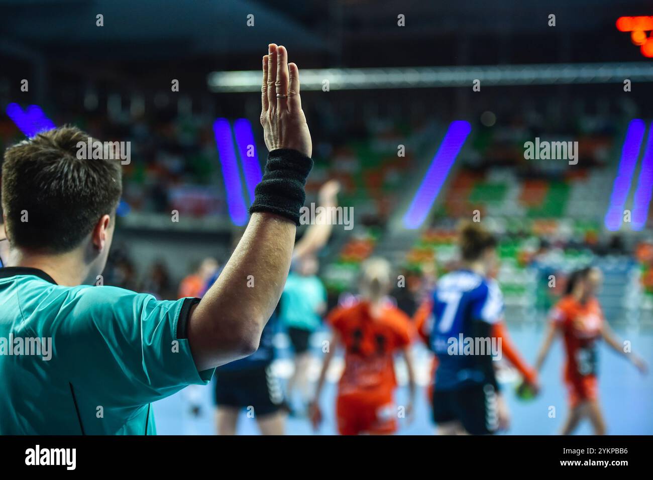 Handball referee gives signal playing for time during handball match ...