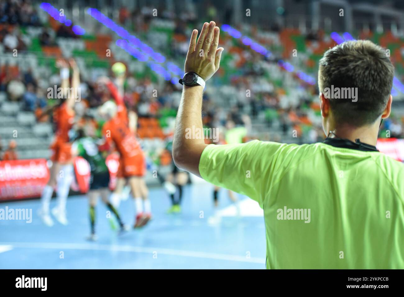 Handball referee gives signal playing for time during handball match ...