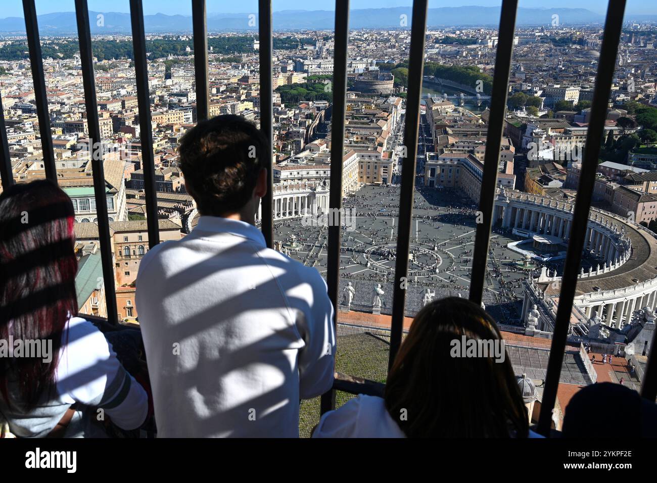 Visitors on the top of Saint Peter's Basilica in Vatican. People on the ...