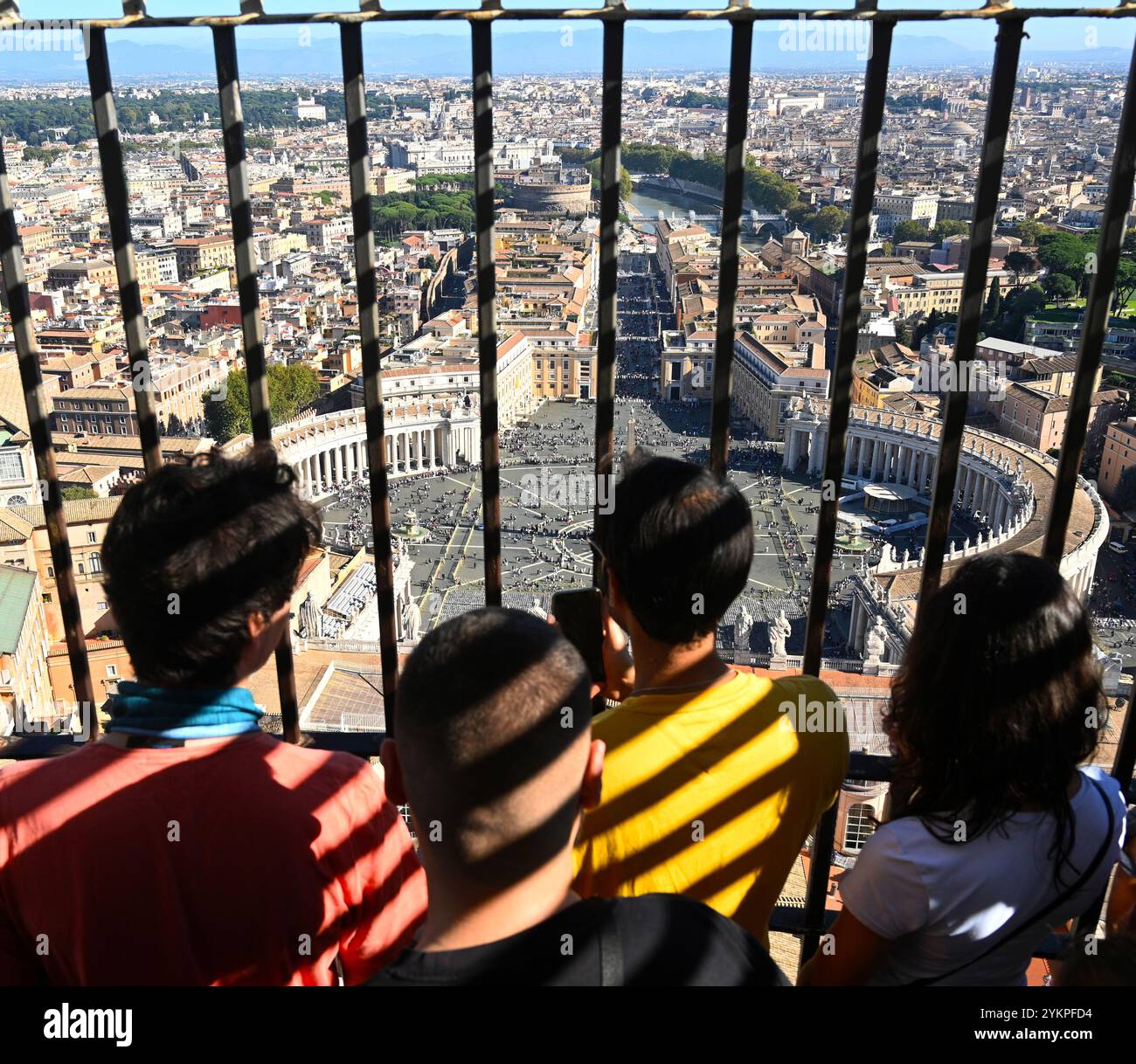 Visitors on the top of Saint Peter's Basilica in Vatican. People on the ...