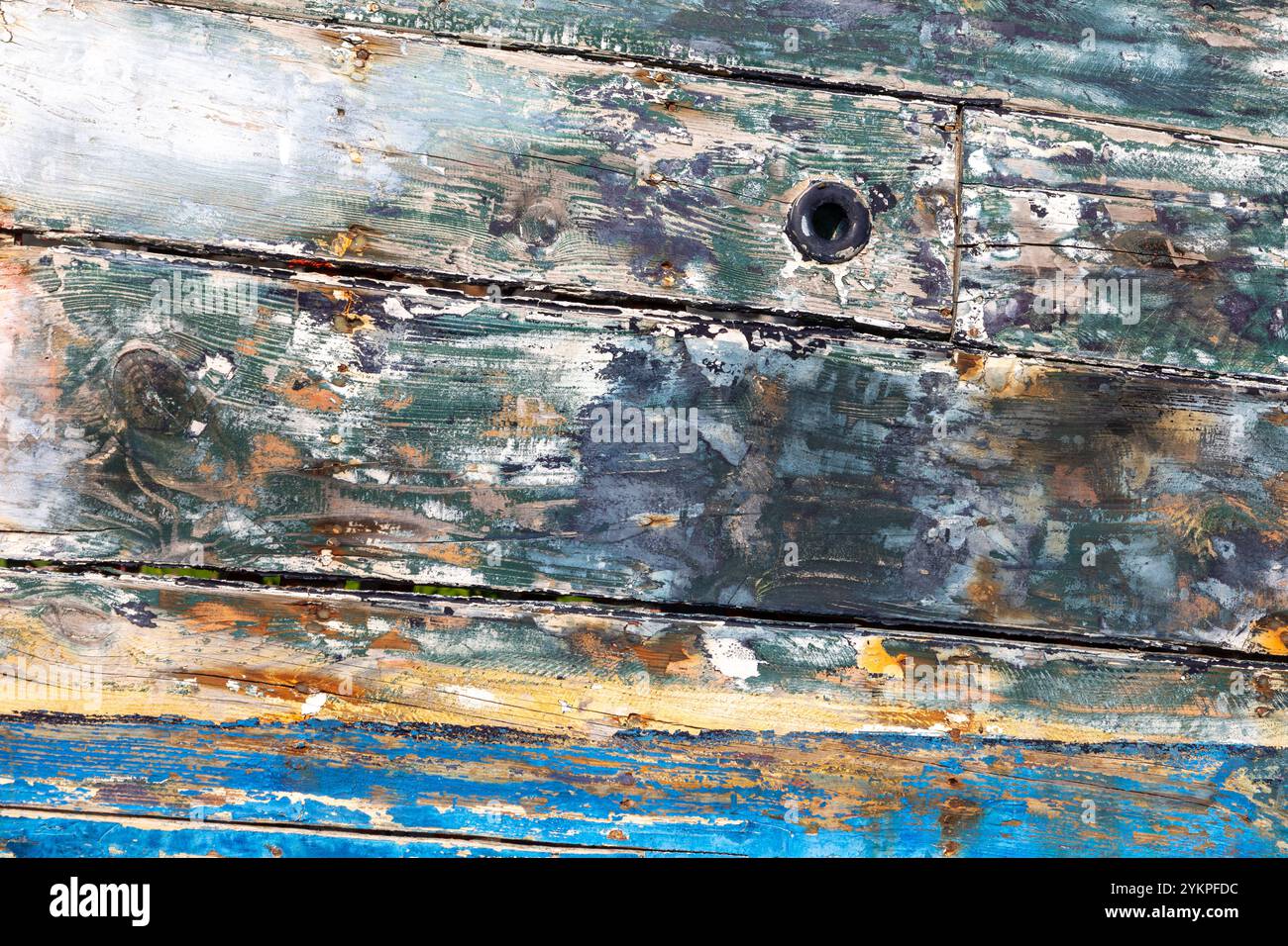 pattern of old rotten wooden planks at an old ship in harmonic aging ...