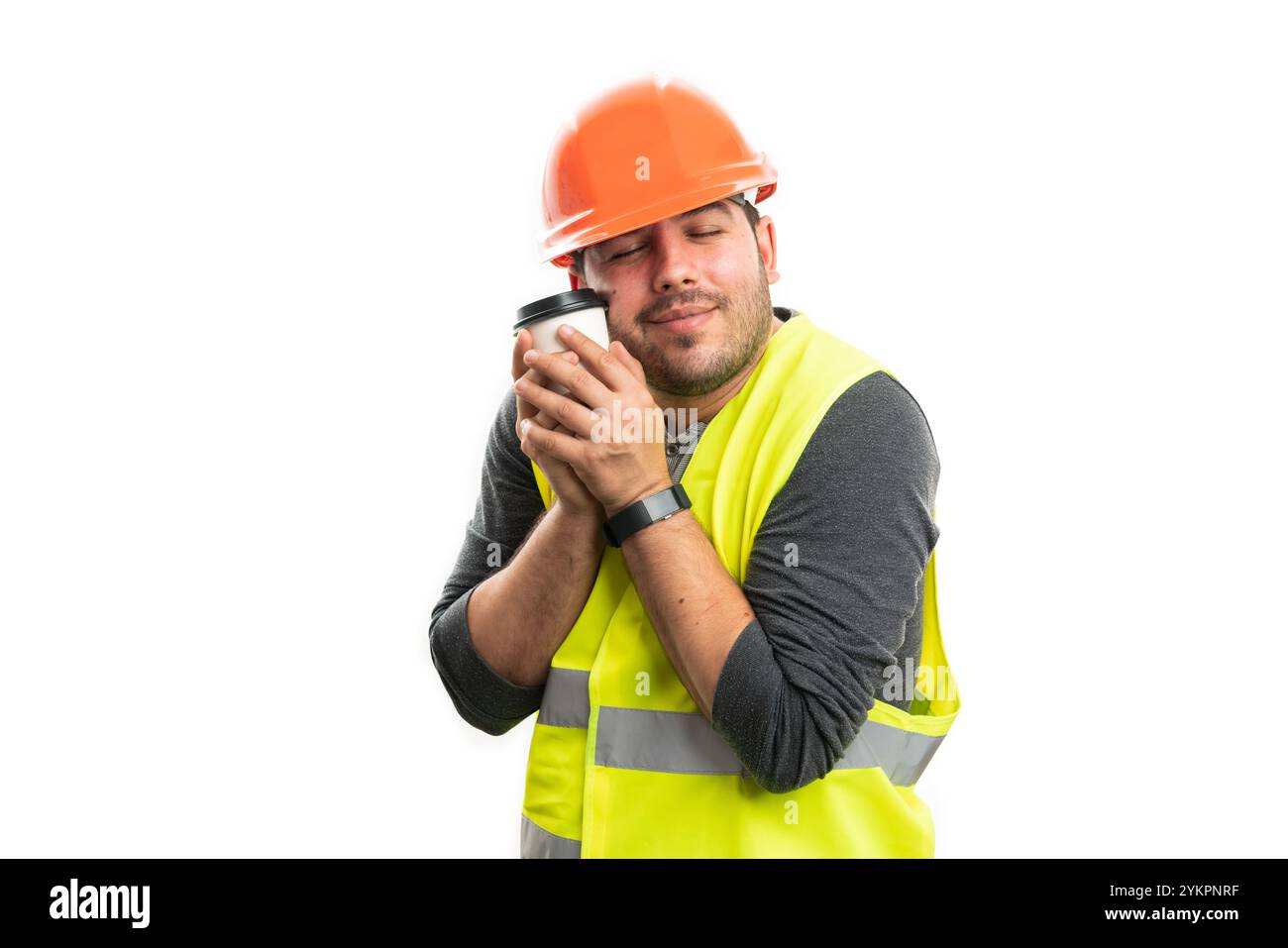 Happy builder man as coffee lover hugging paper take-away to-go cup ...