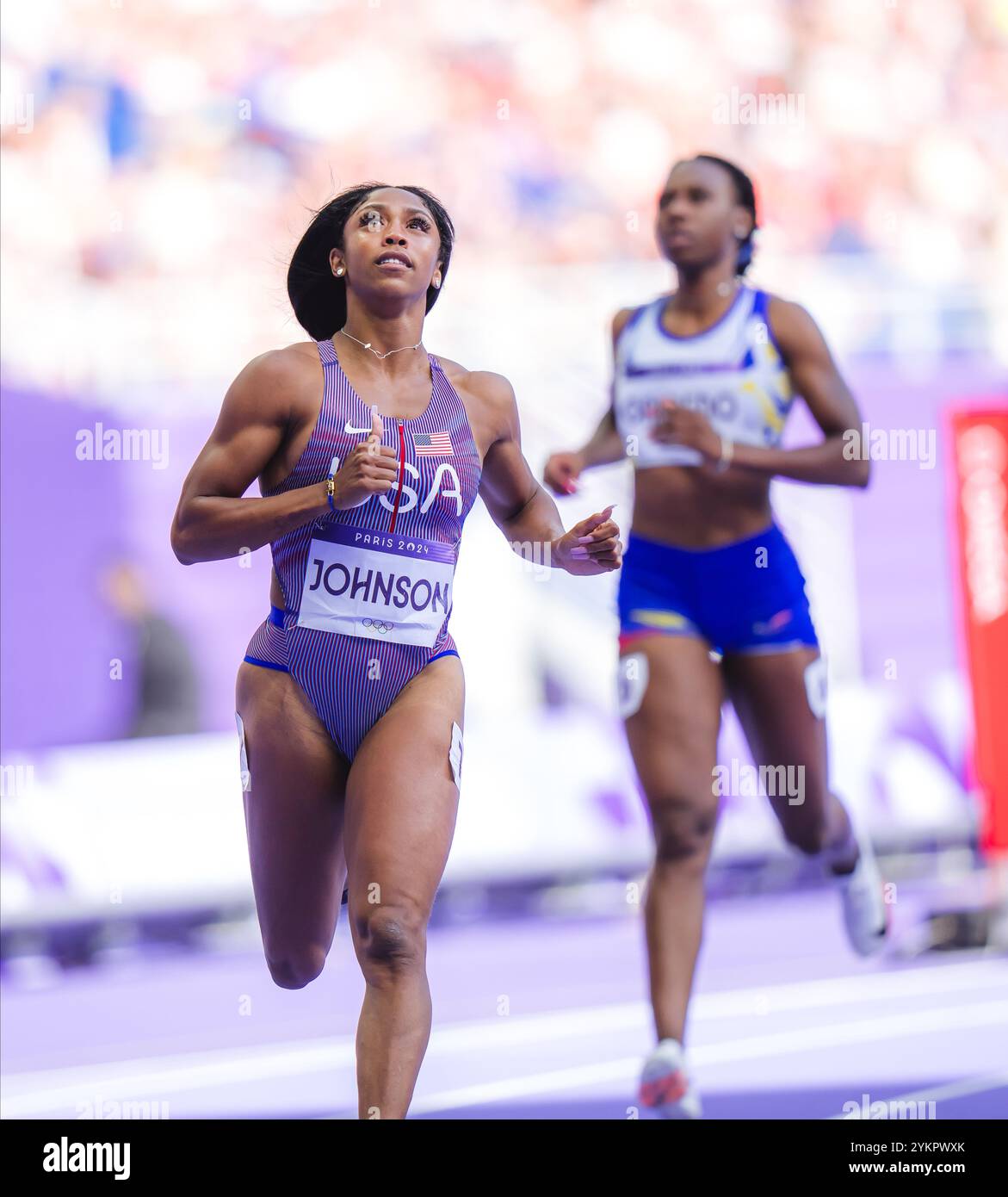 Alaysha Johnson participating in the 100 meters hurdles at the Paris ...