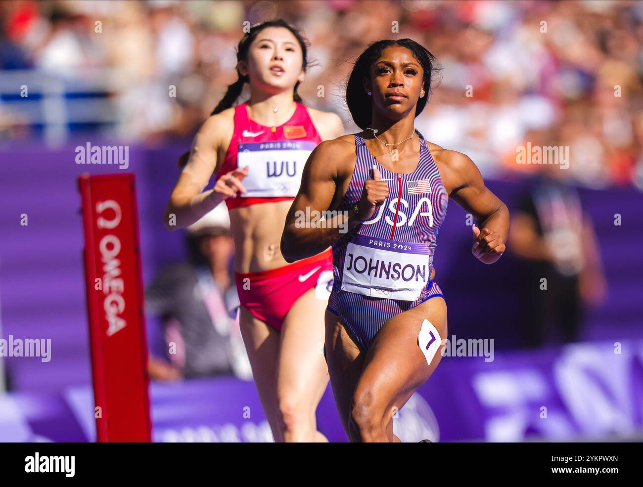 Alaysha Johnson participating in the 100 meters hurdles at the Paris ...