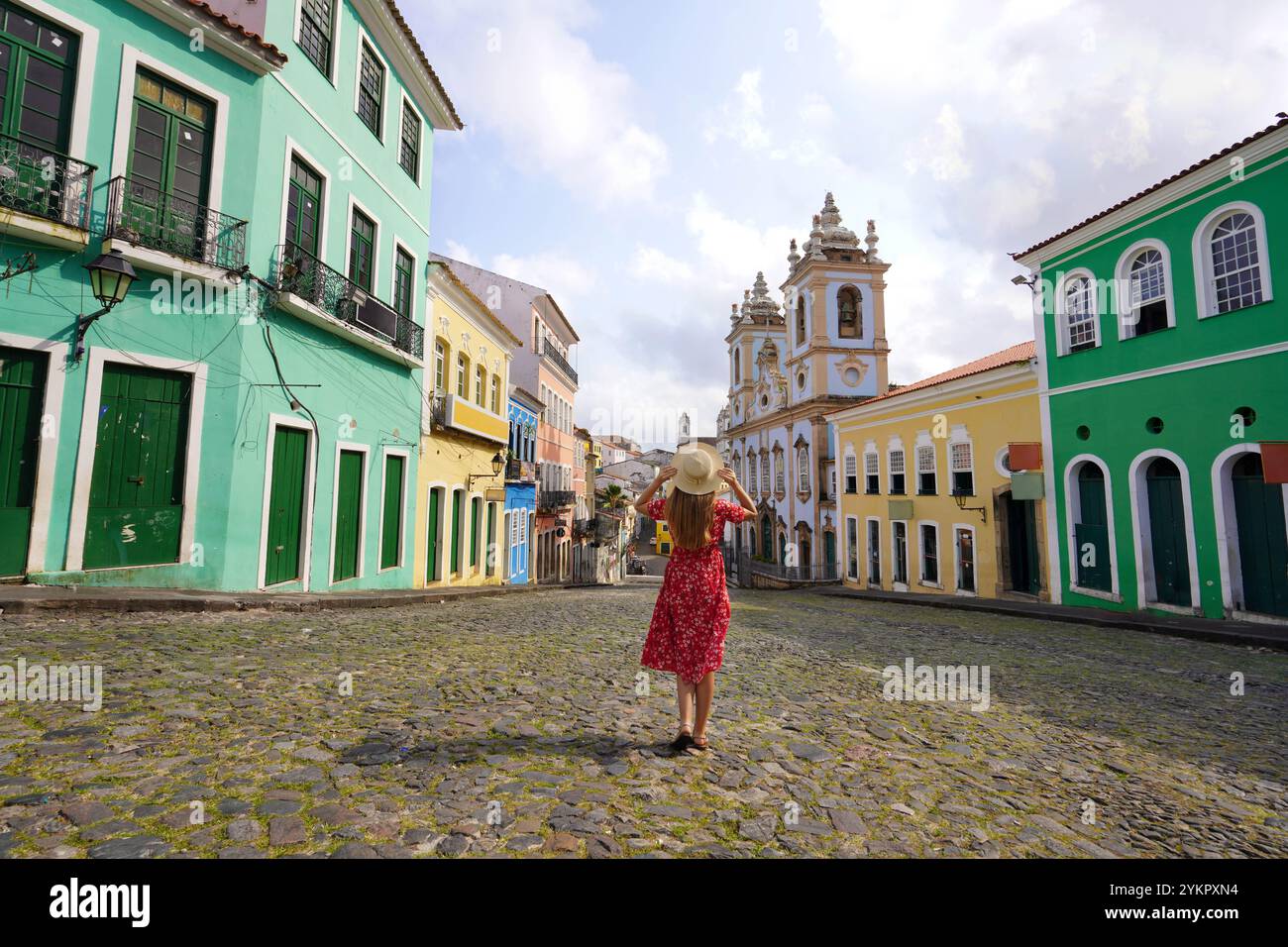 Visiting Salvador de Bahia, Brazil. Rear view of young tourist woman in the famous Pelourinho ...