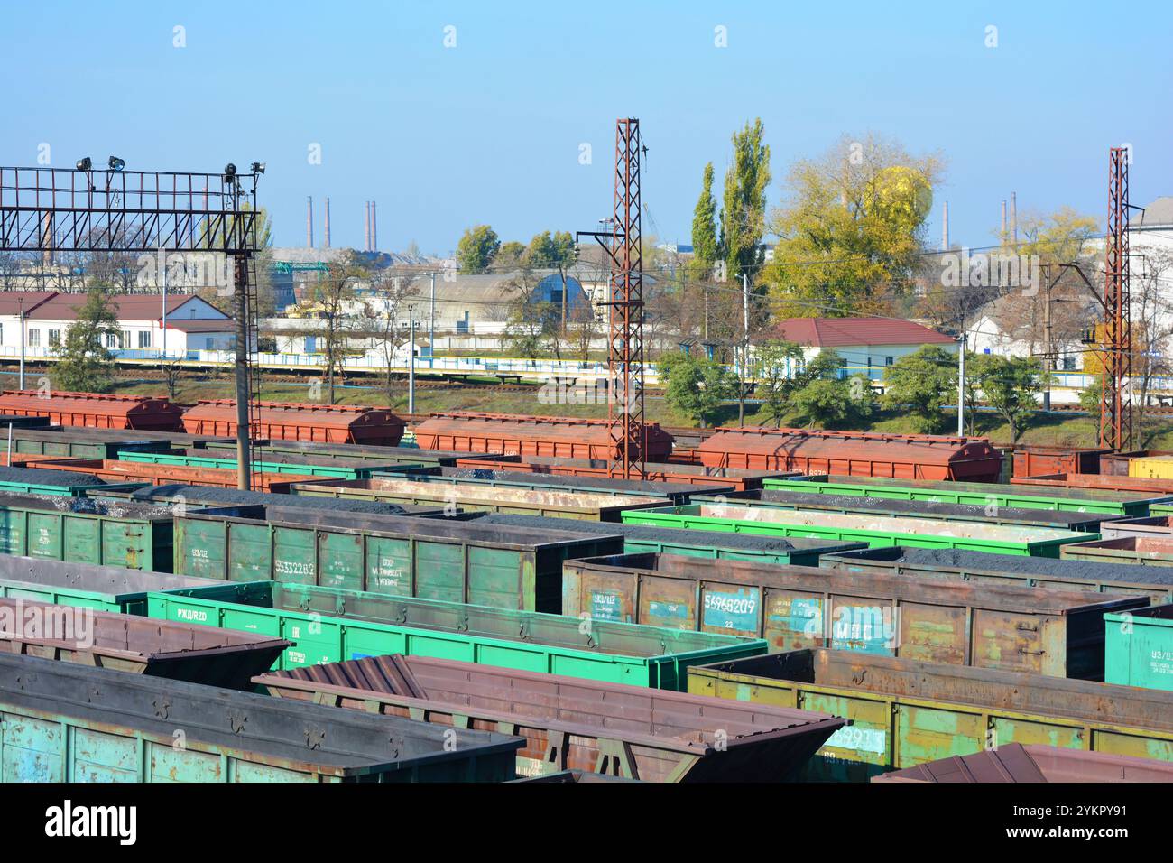 A bright transport interchange of a railway junction with trains and ...