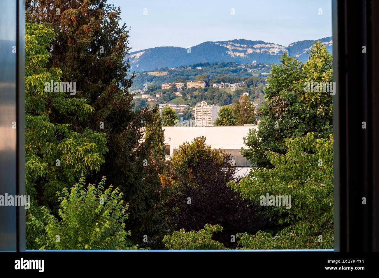 Cityscape view through window Stock Photo - Alamy