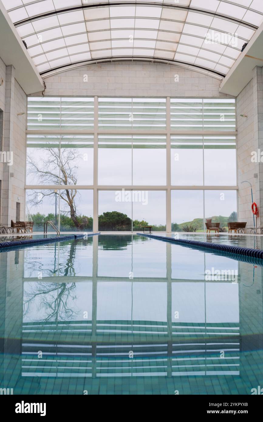 Symmetrical indoor swimming pool design Stock Photo - Alamy