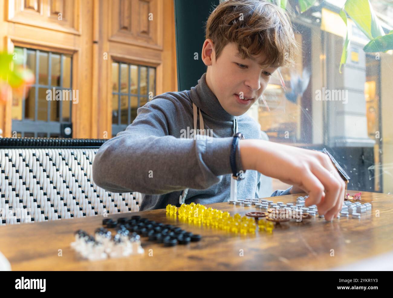 Boy setting up table hi-res stock photography and images - Alamy