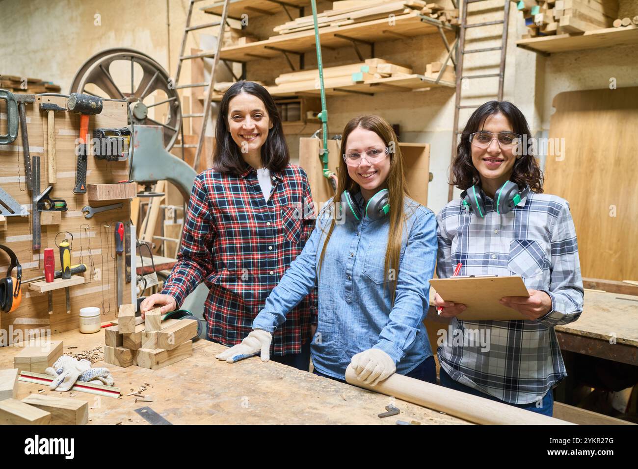 A diverse group of women working together in a lumberyard, showcasing ...