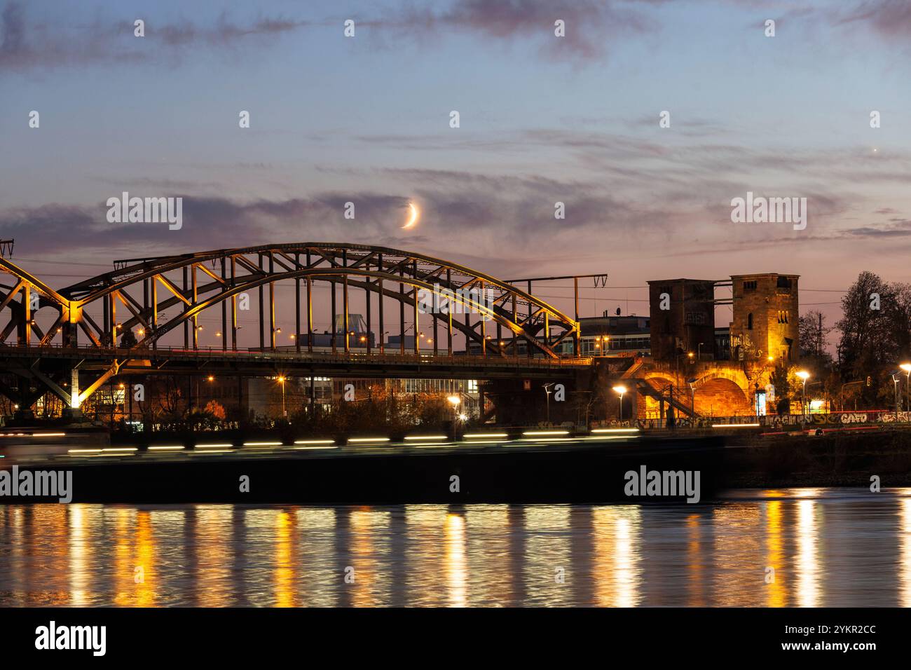 crescent moon over the Suedbruecke (South bridge), railroad bridge over ...