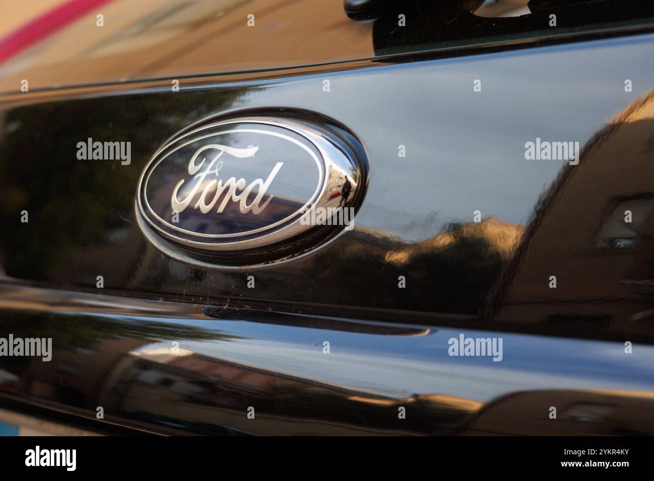 Close-up of Ford logo on black car Stock Photo - Alamy