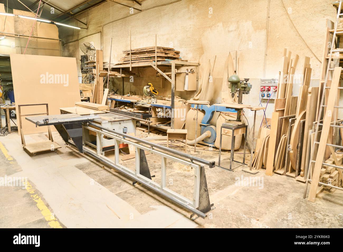 An interior view of a lumber workshop featuring various woodworking ...