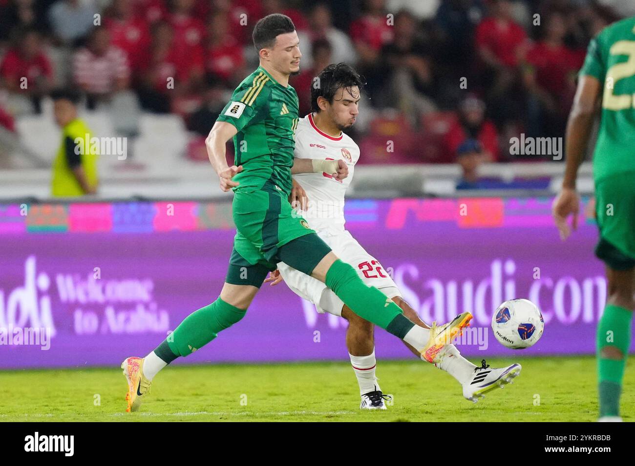 Indonesia's Nathan Tjoe A On battles for the ball against Saudi Arabia ...