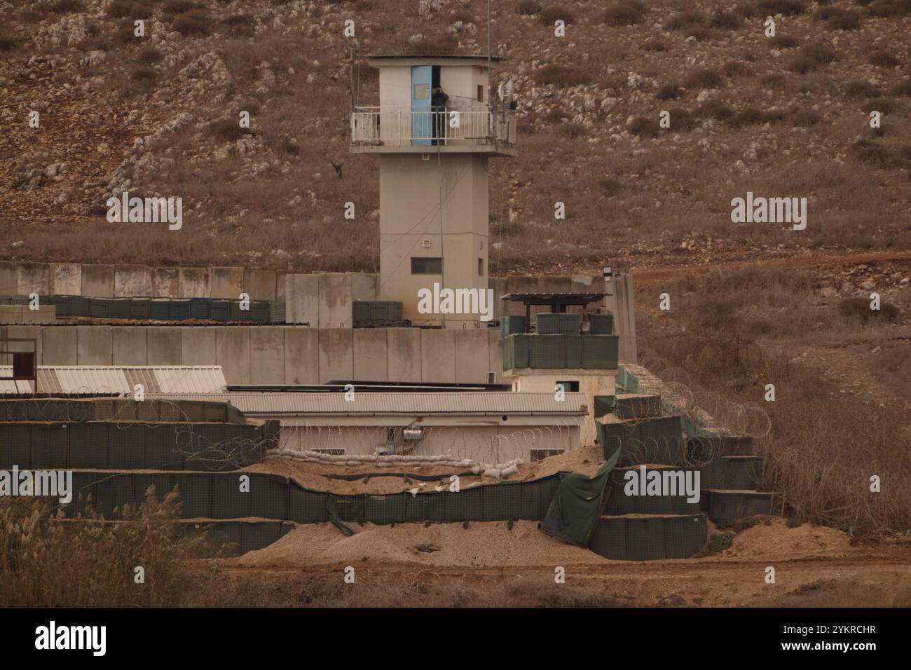 An UN soldier stands on the top of a tower at a base of the United ...