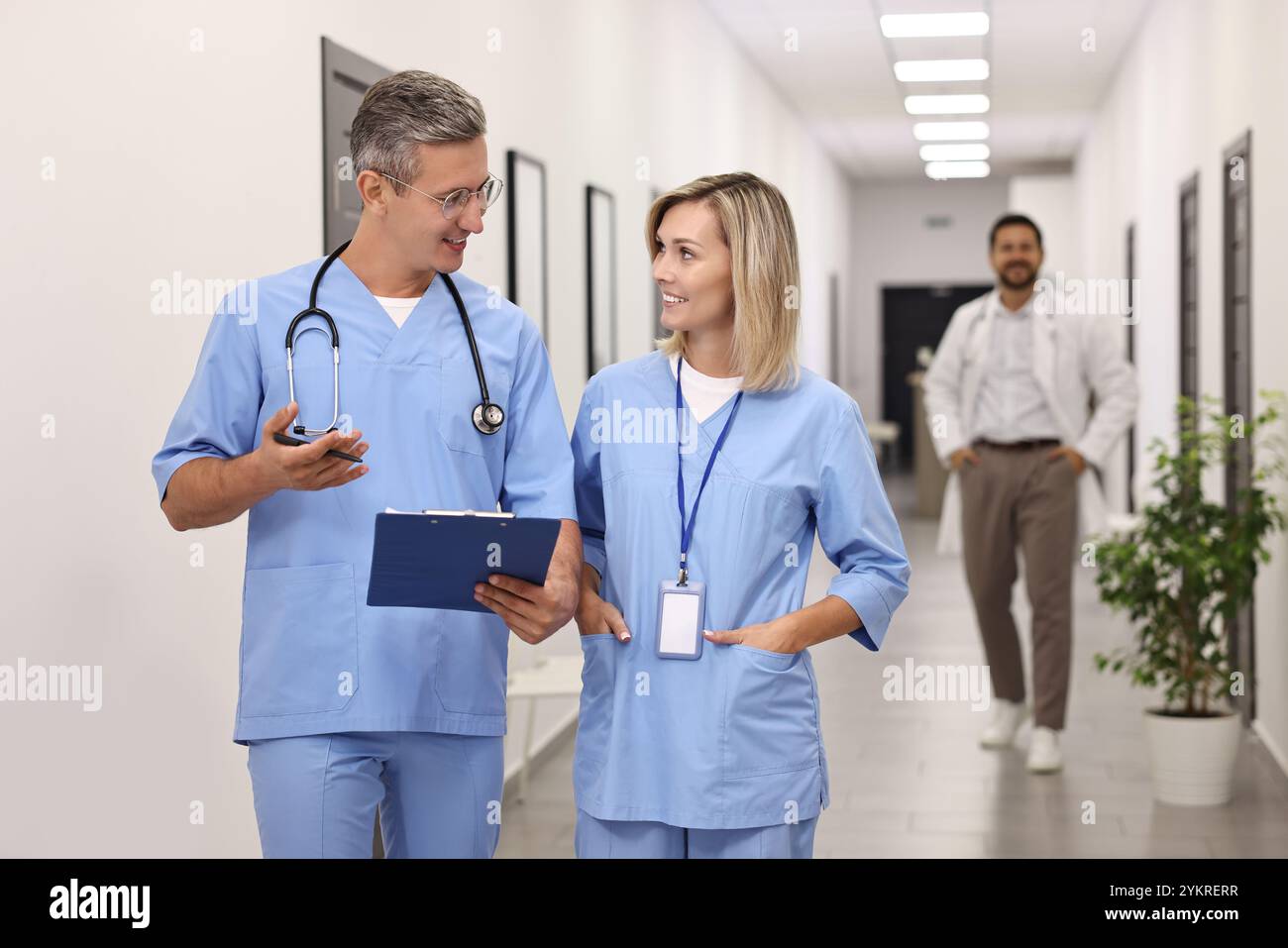 Health care workers colleagues talking hi-res stock photography and ...