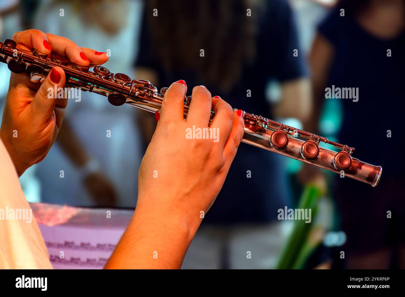 Young woman playing flute hi-res stock photography and images - Alamy