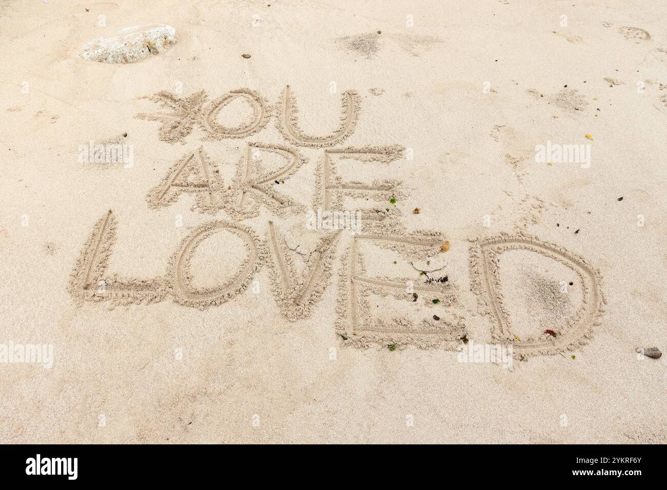 Motivation quotes You are Loved written in the sand of the beach Stock ...
