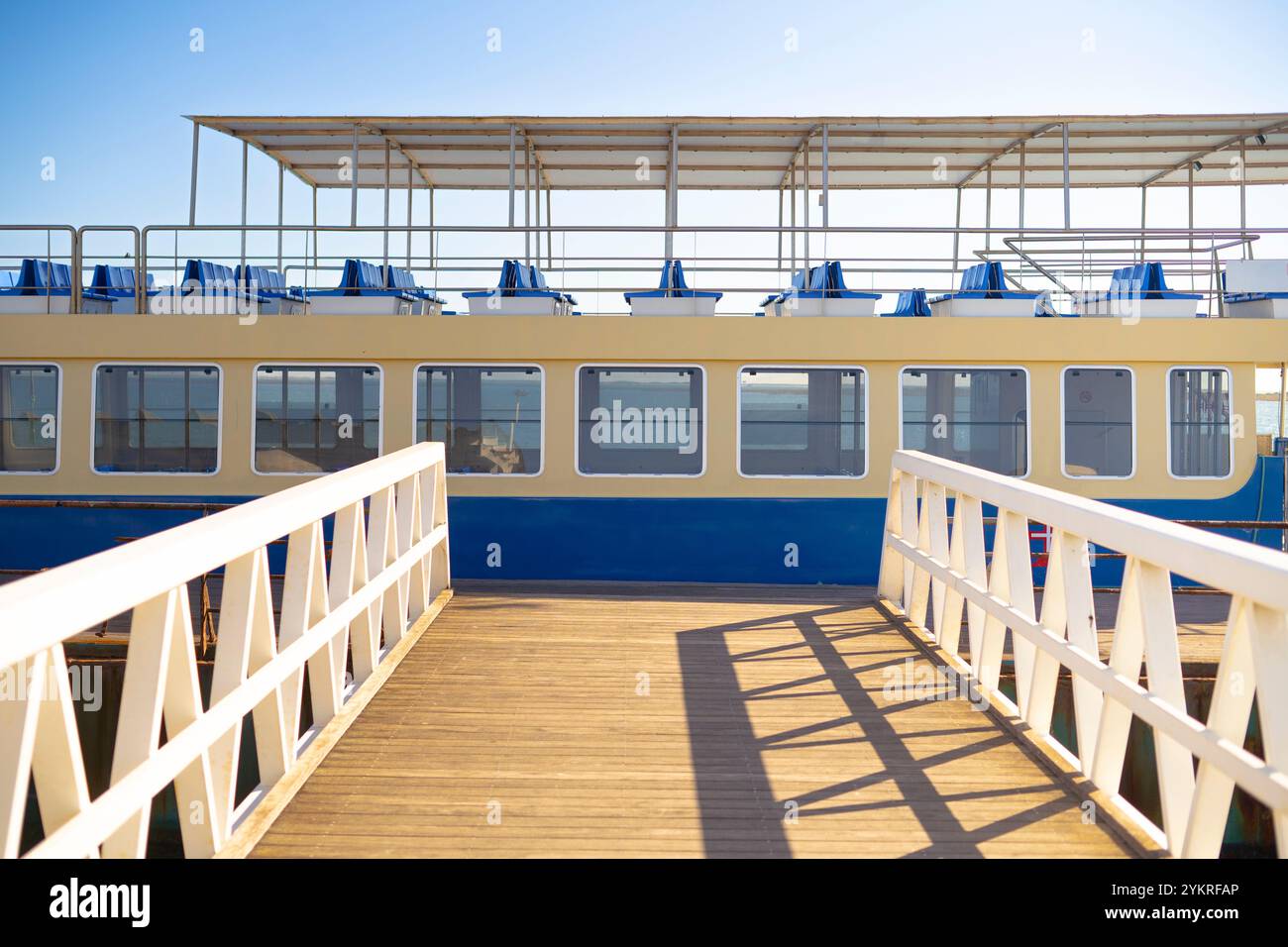 Passenger Ship and Boardwood walk bridge in Faro's Harbour, Portugal ...