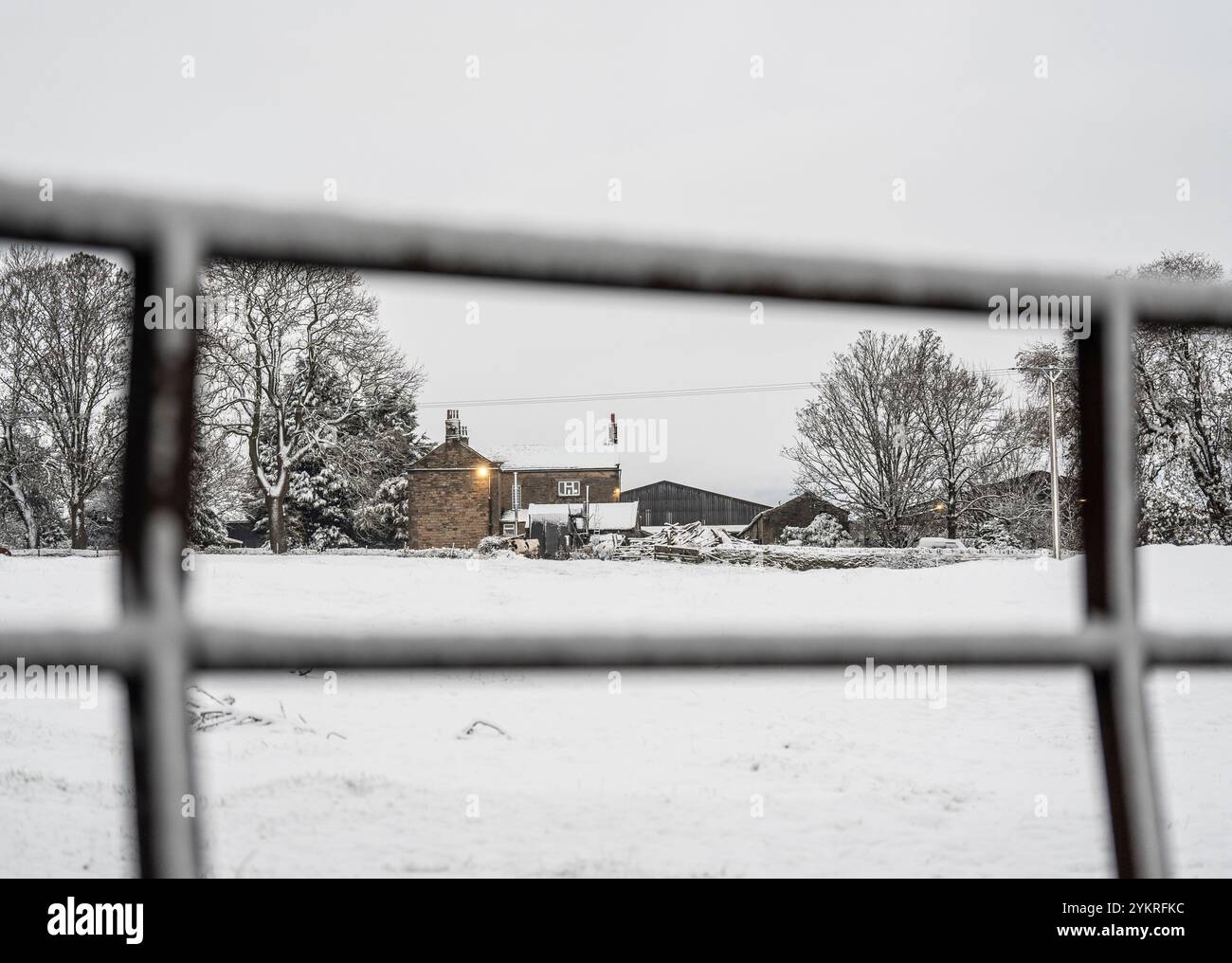 A snow covered farmhouse in Clayton West, West Yorkshire. The UK is ...
